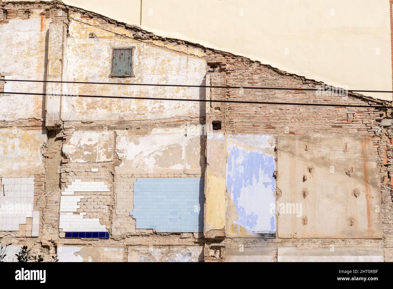 interior partition of a house exposed by demolition, dividing wall to ...