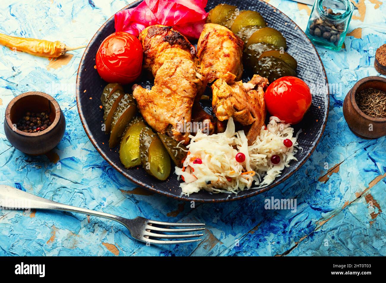 Fried chicken meat and a side dish of pickles. English cuisine Stock ...