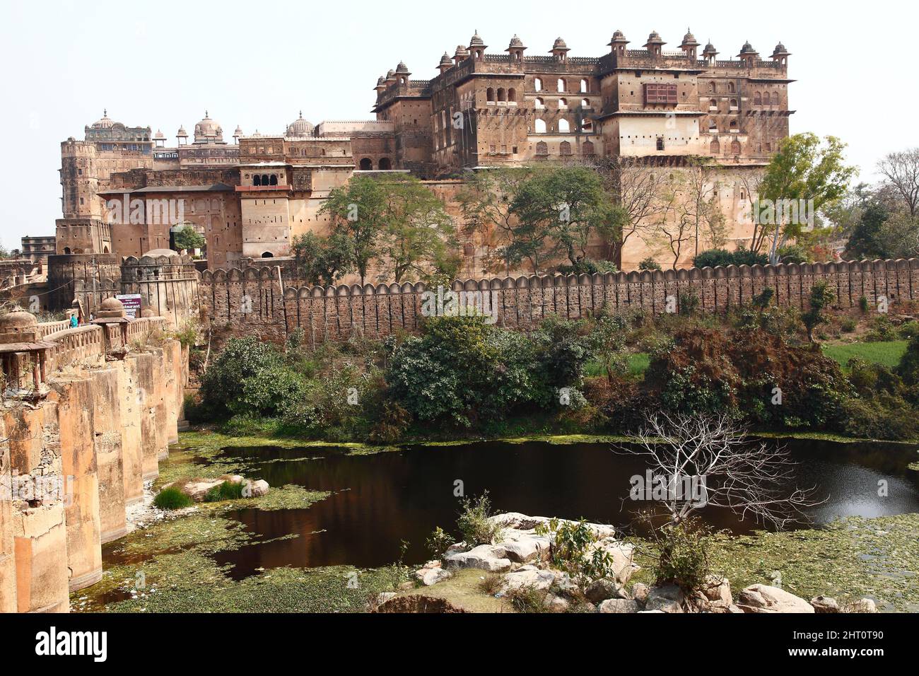 Exterior of Raj Mahal Palace with granite bridge over water channel in ...