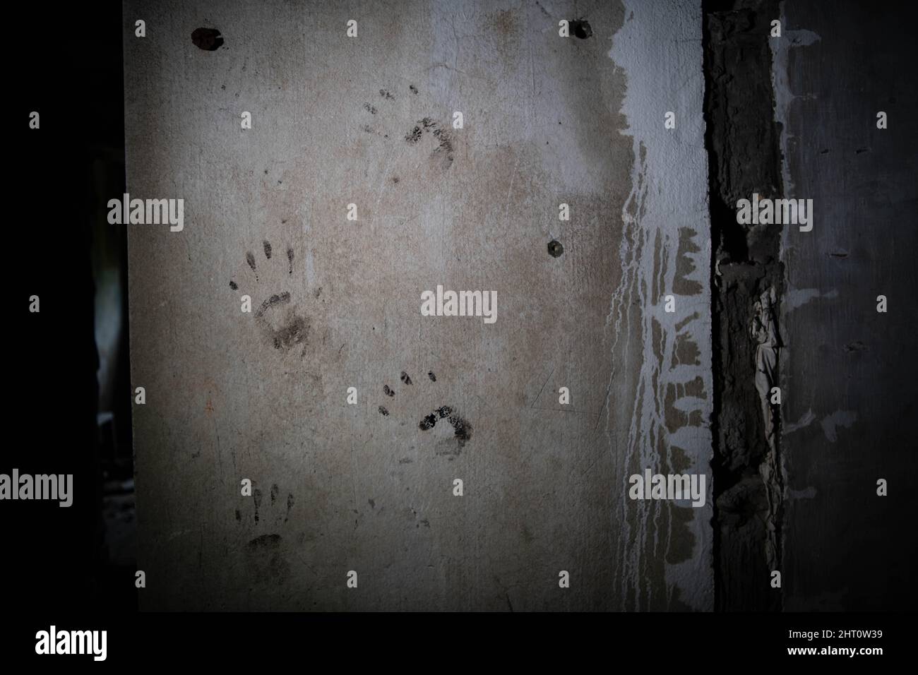 Black stains of hands on an old wall surface Stock Photo - Alamy