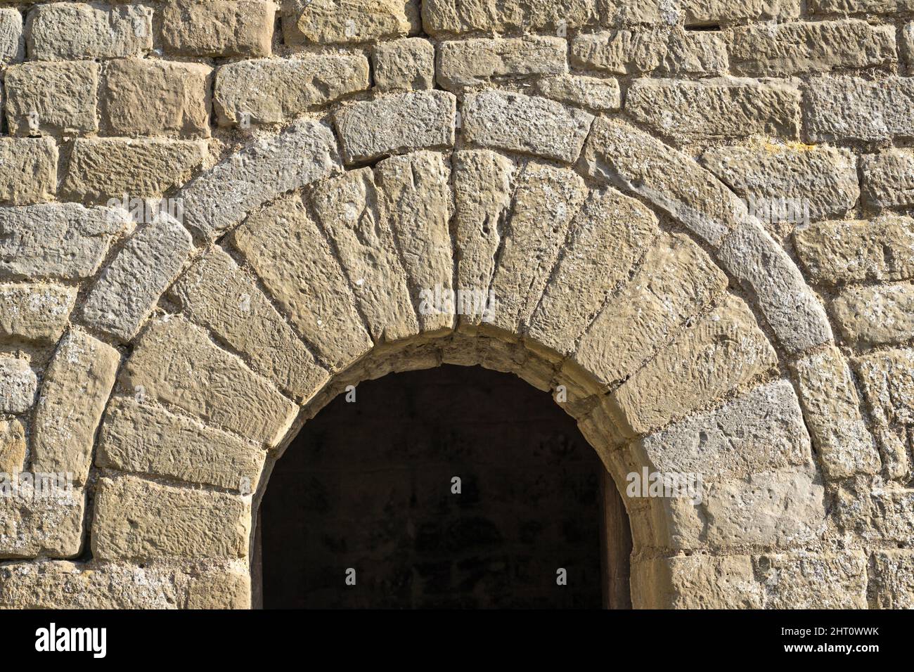 semicircular arch at the entrance of a small chapel Romanesque ...