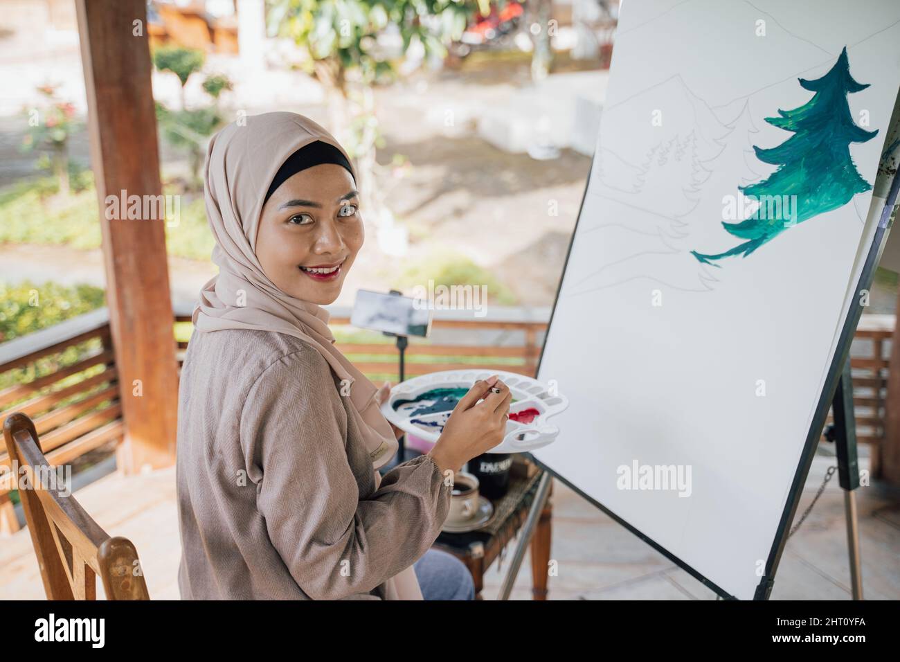 Muslim asian female artist painting hi-res stock photography and images ...