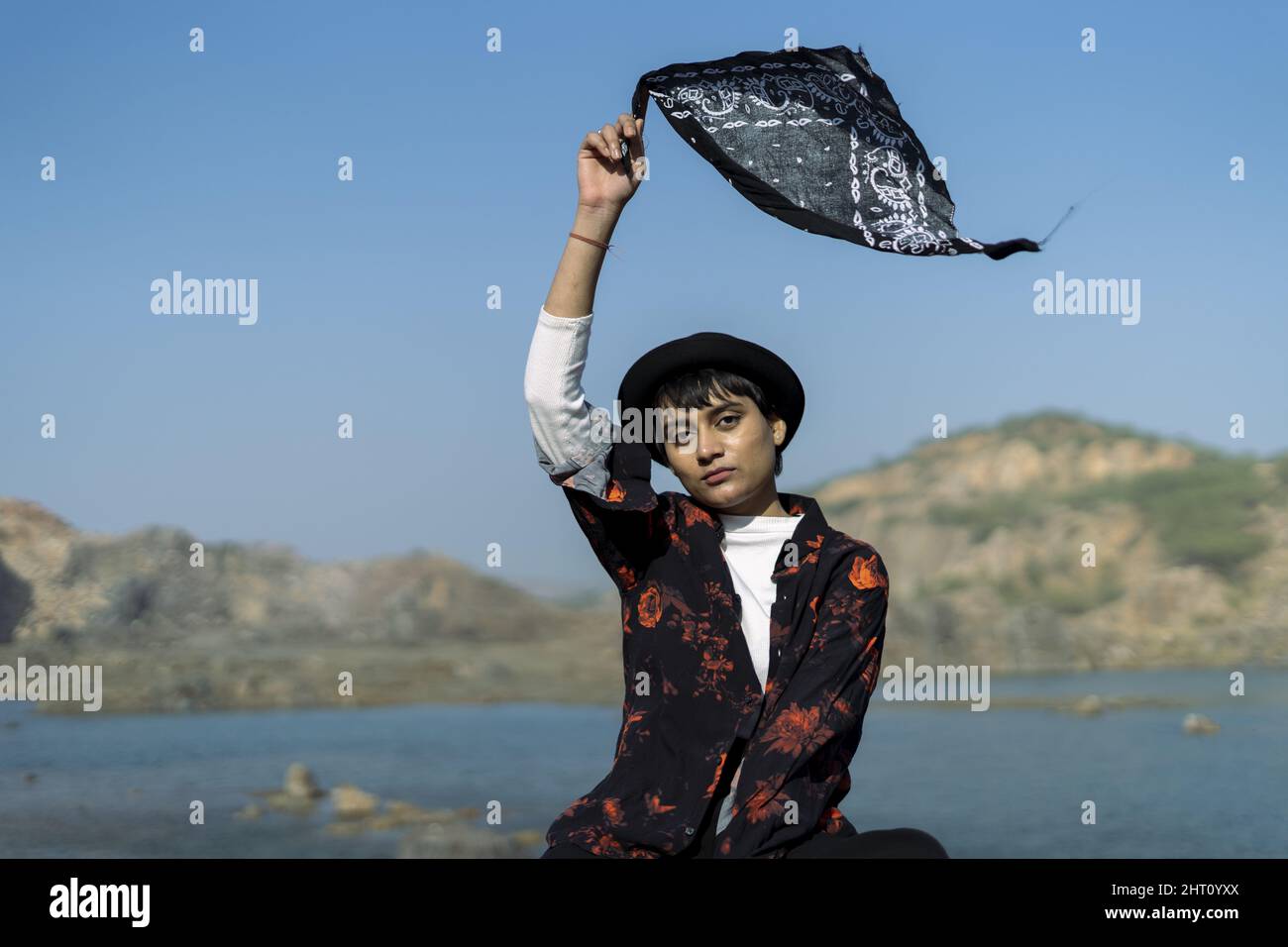 Artistic portrait of an Indian female holding a handkerchief on ...