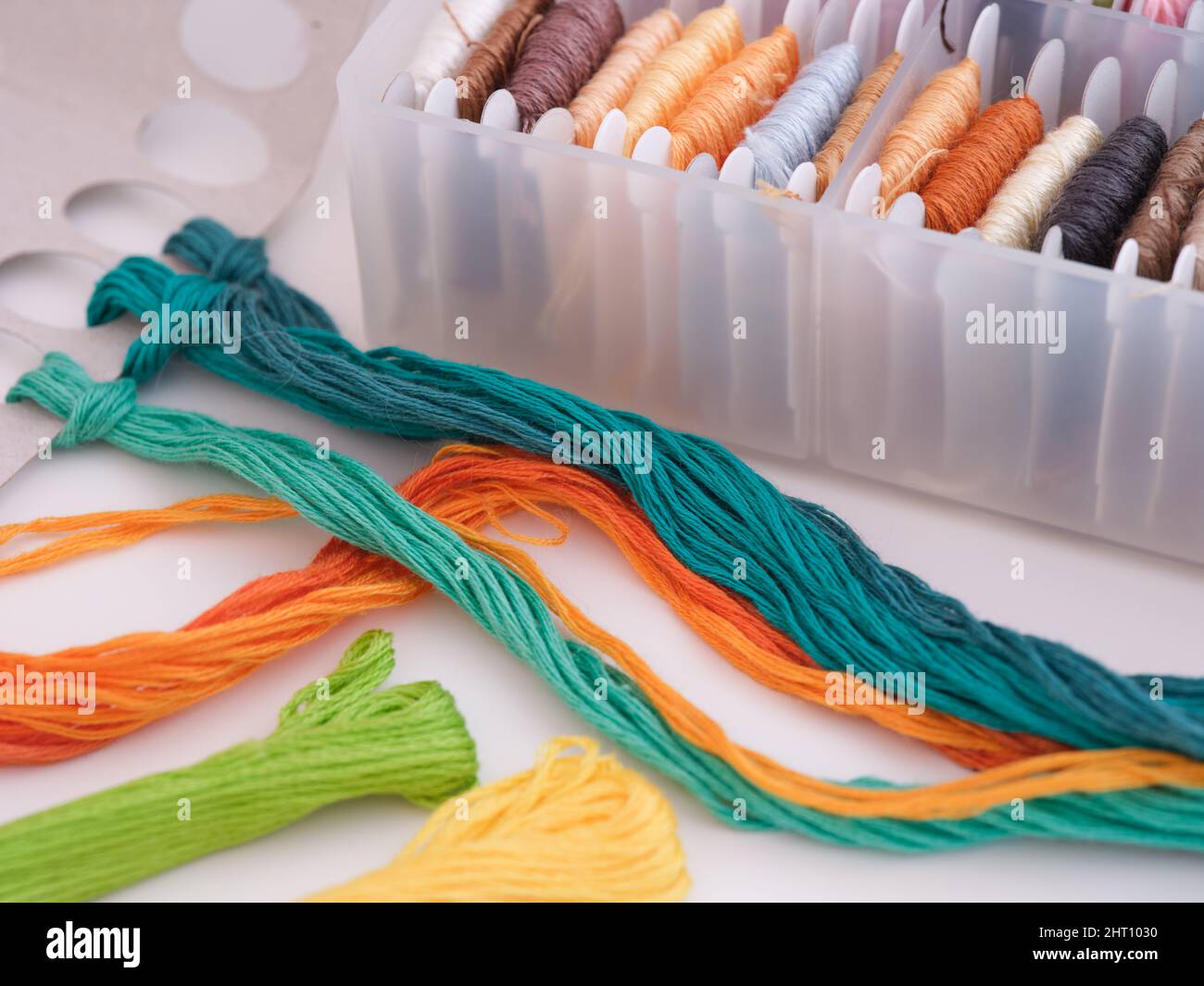 Colorful cross stitch embroidery threads. Close up Stock Photo - Alamy