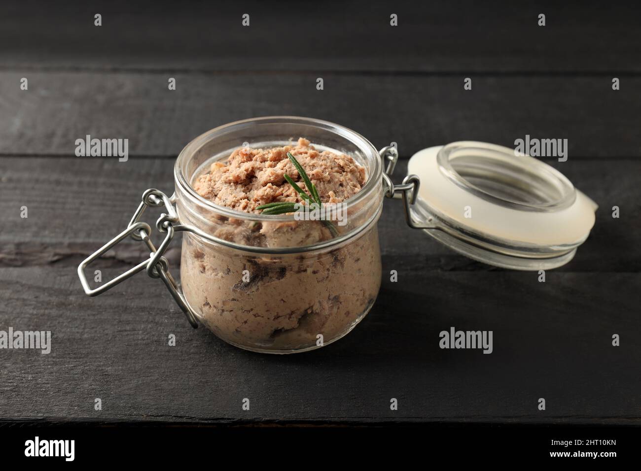 Glass jar of pate on wooden background Stock Photo - Alamy