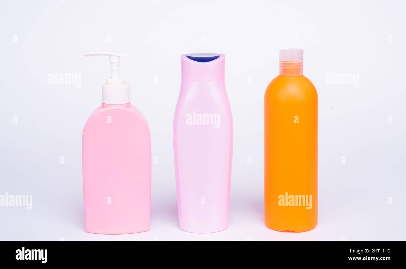 Refillable shower and bath gel product containers in row isolated on ...