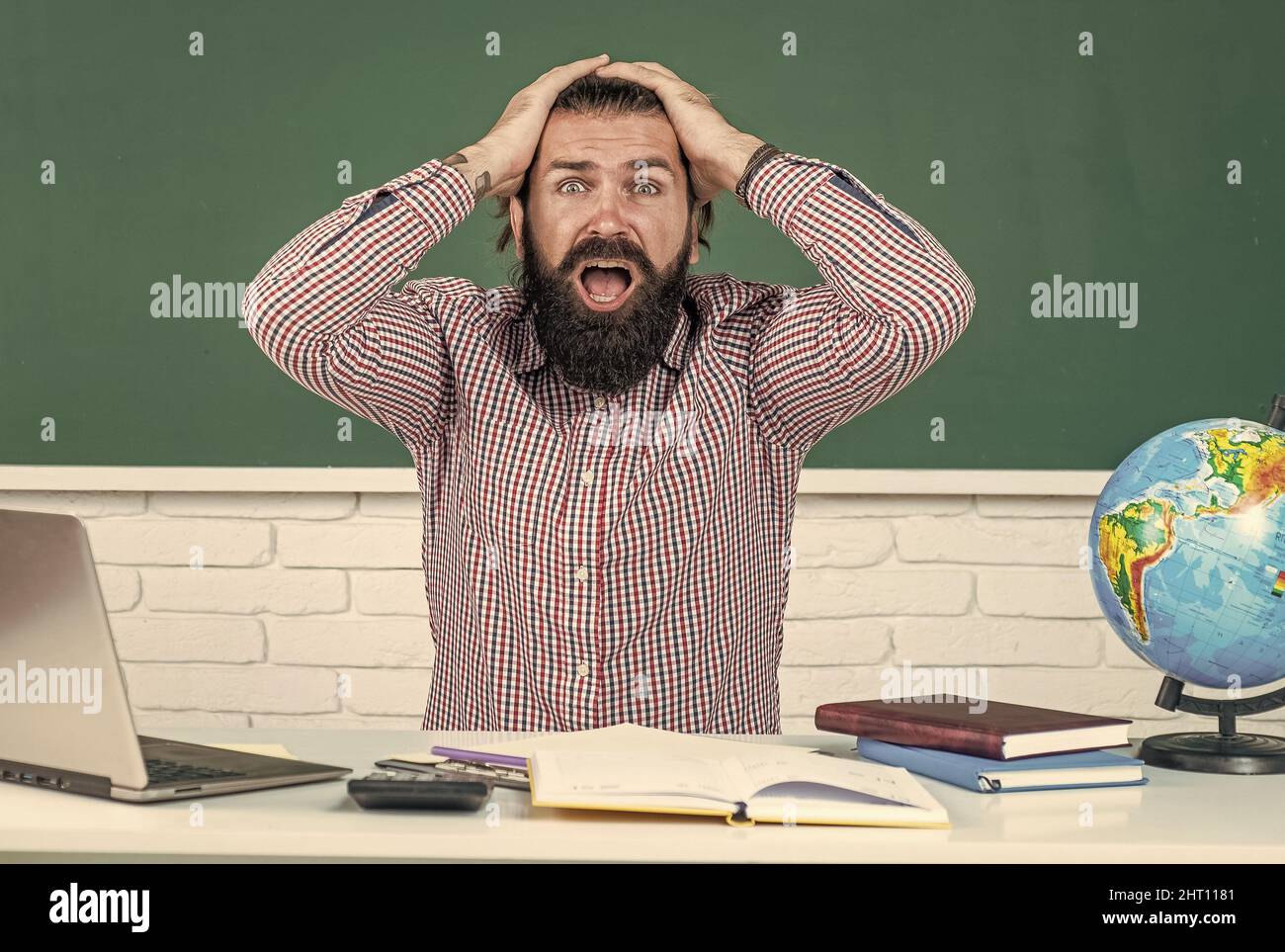 male student sit in school classroom while hard lesson. pass the exam ...