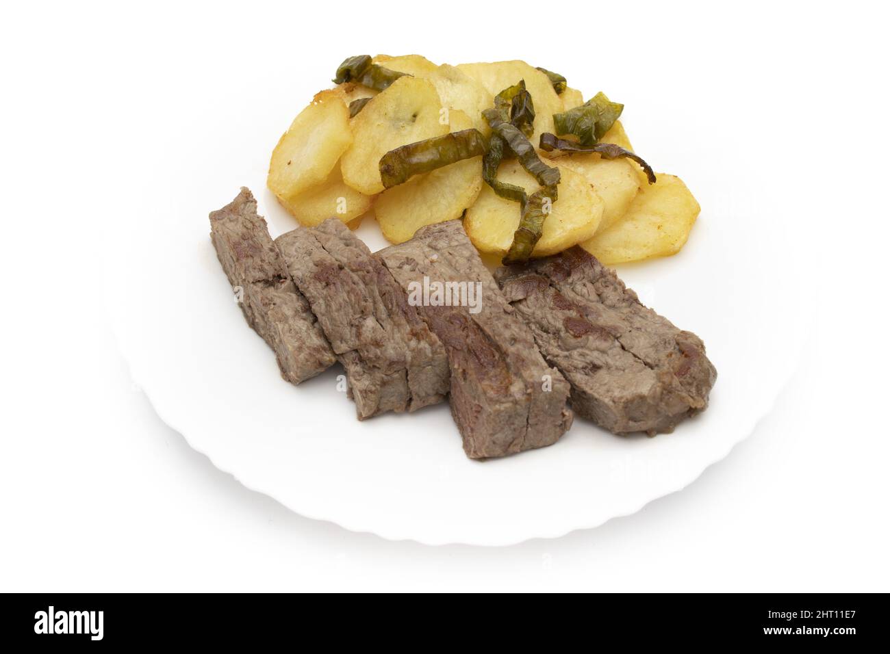 Closeup shot of French fries with roast beef cut into strips isolated ...