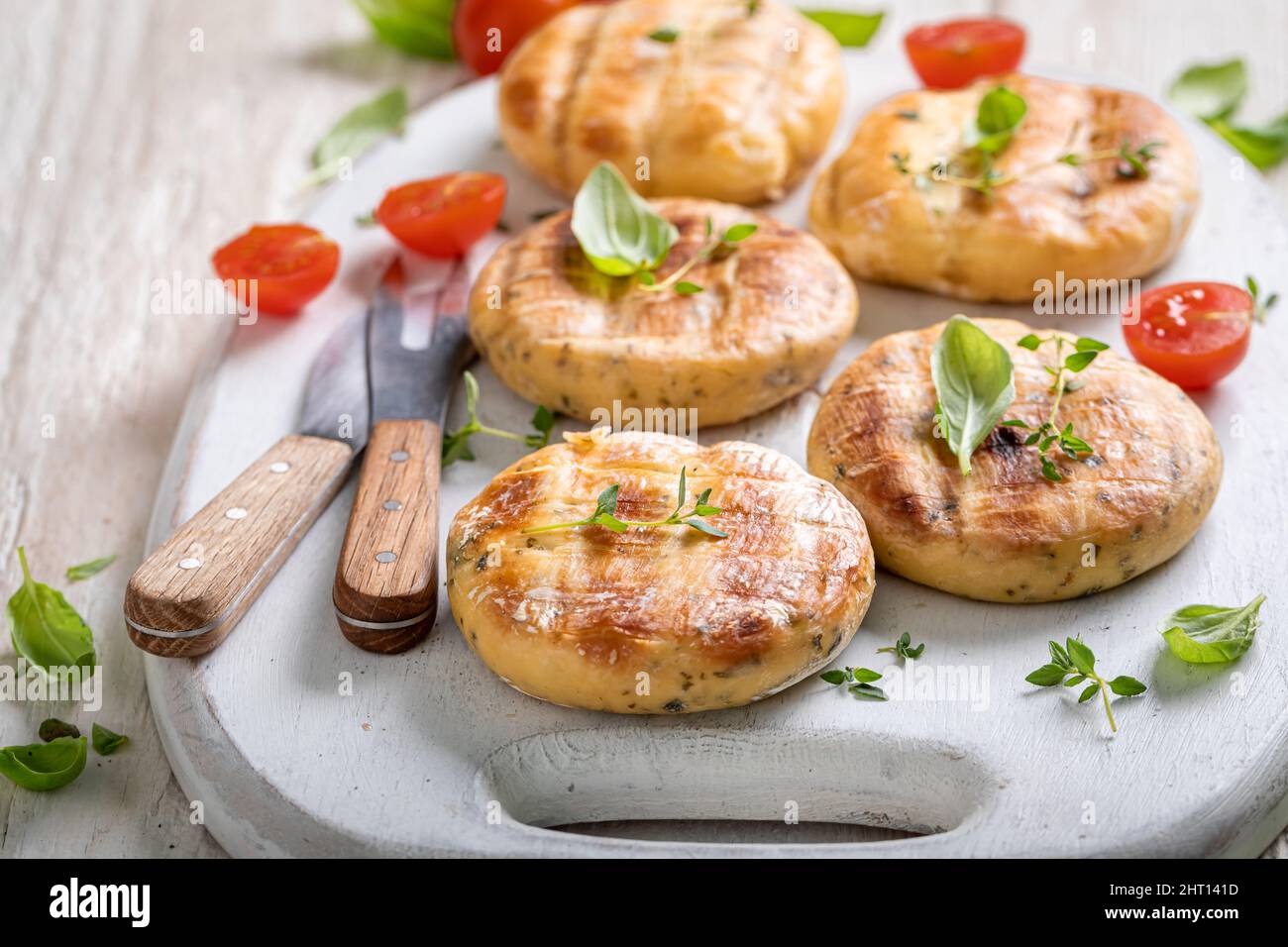 Crispy roasted halloumi cheese on a grill with fire. Crispy grilled ...