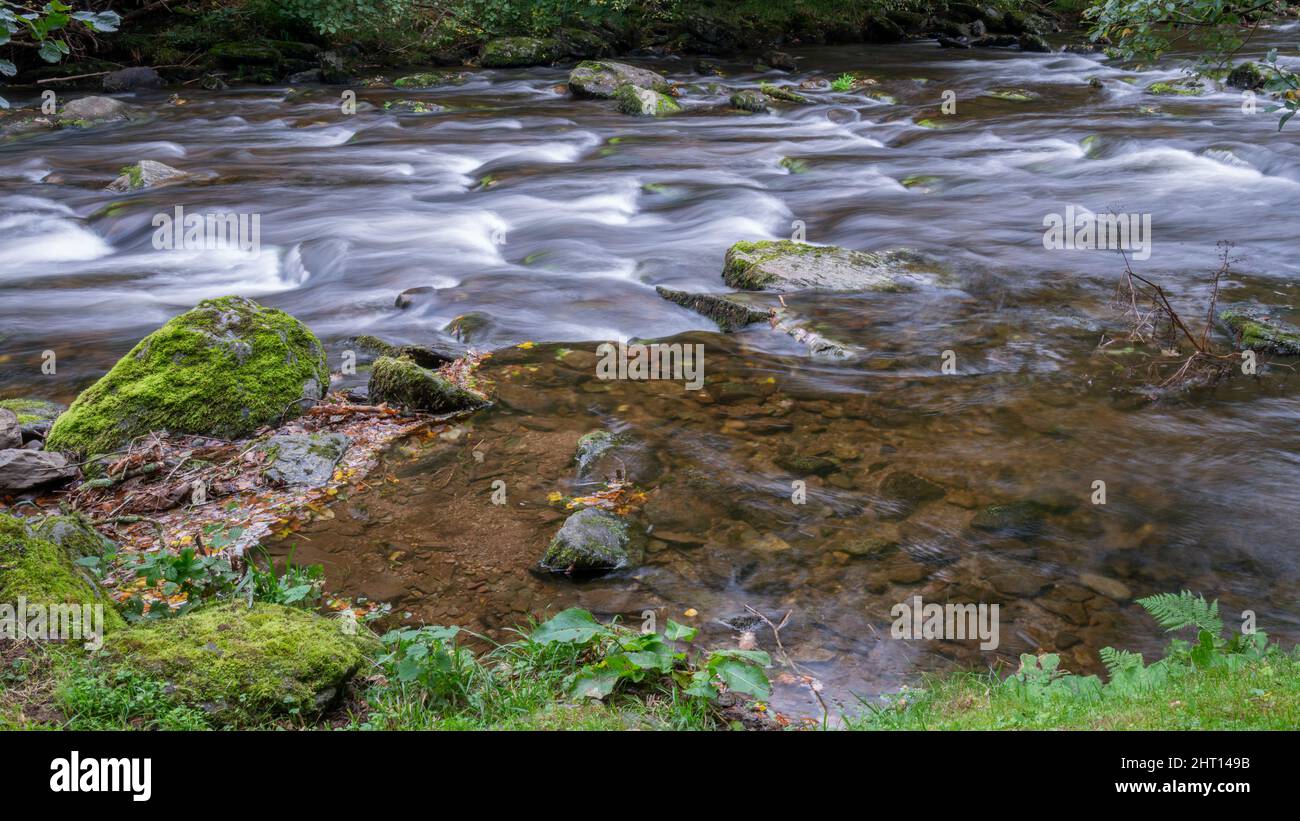 View of fast flowing water in the East Lyn River Stock Photo - Alamy