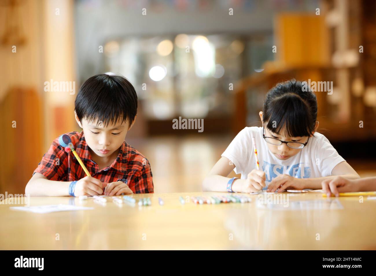 Creative Education Fun Kindergarten Art Class A cute boy and a pretty ...