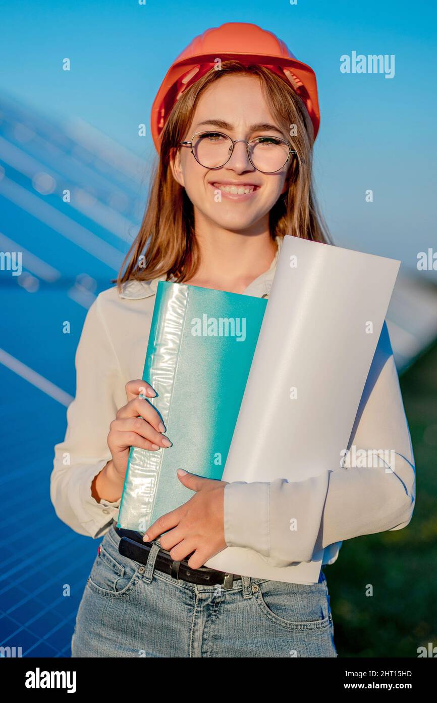 Businesswomen working on checking equipment at solar power plant with ...