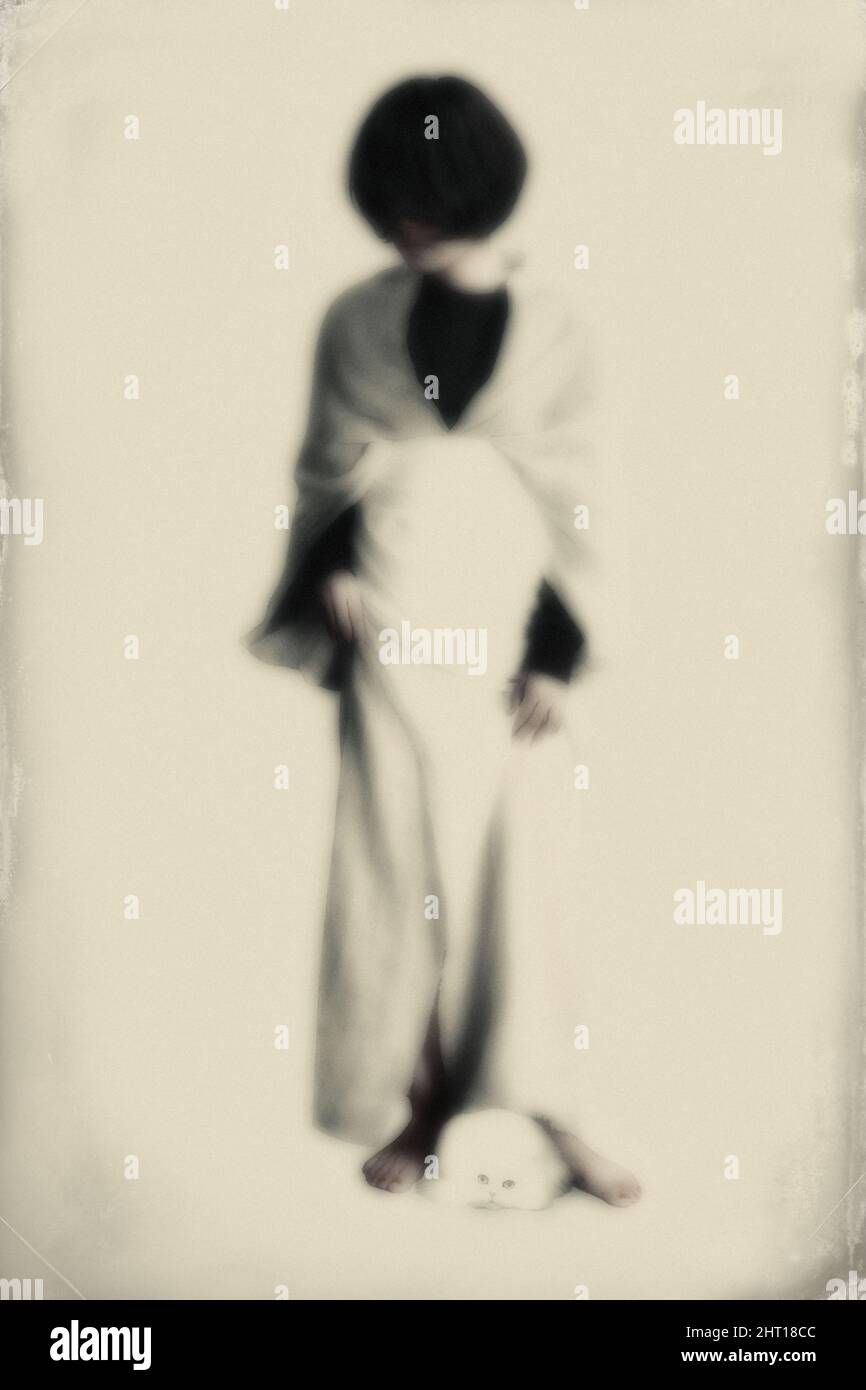 Blurred grayscale view of a sad depressed female girl with a light ...