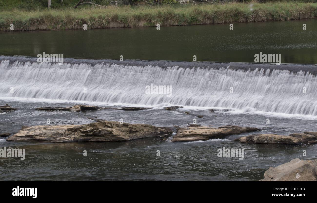 Water flows over a small dam on the New River in Grayson County ...