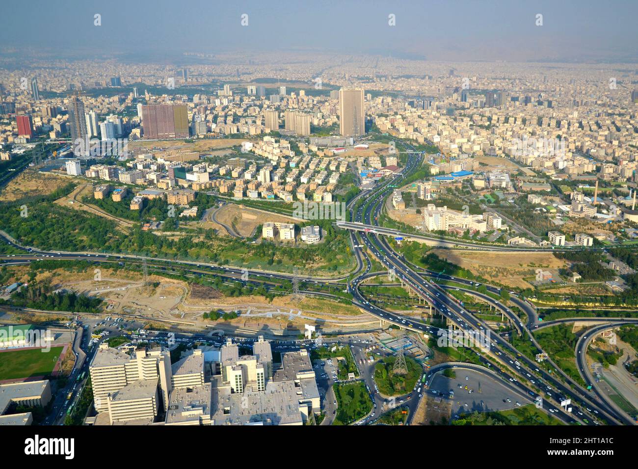 View of the city, highway and surrounding houses from the Milad Tower ...
