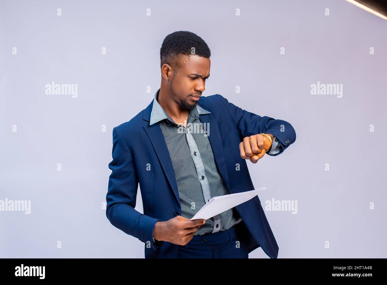 African business man holding papers isolated on white background Stock ...