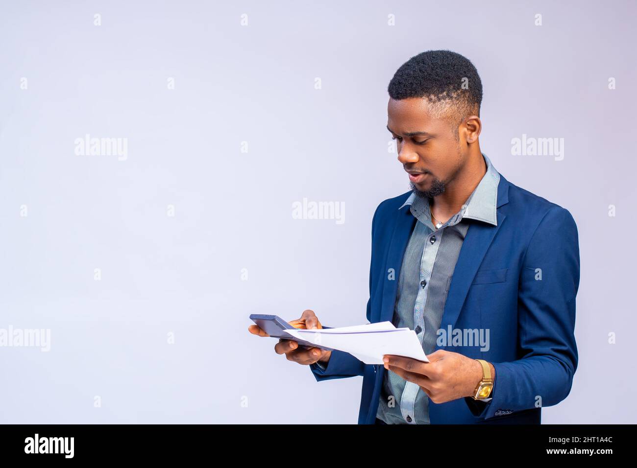 African business man holding papers isolated on white background Stock ...