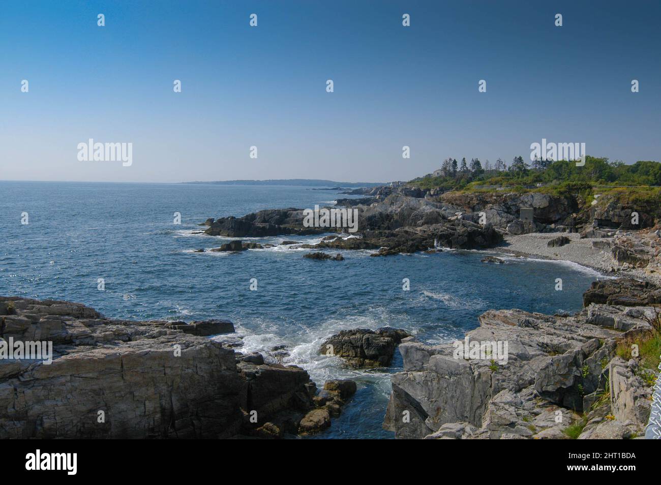 Natural view of a rocky coast under a clear sky in New England Stock ...