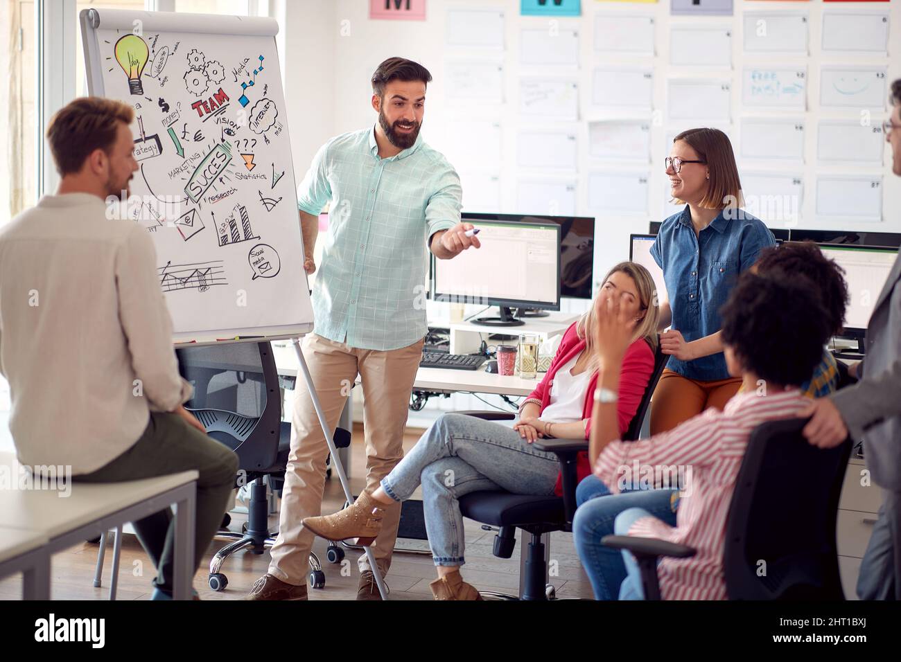 Group of young multiethnic ambitious employees brainstorming together ...