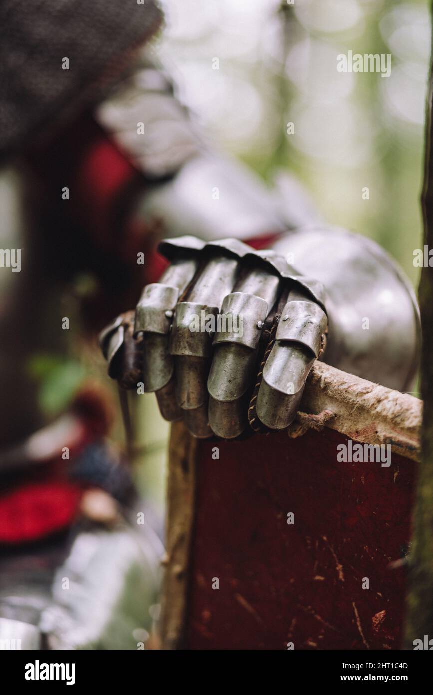Vertical shot of a knight's hand in a steel armour on a shield Stock ...