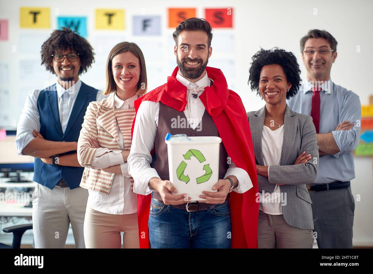 A group of happy employees in a pleasant atmosphere in the office is ...