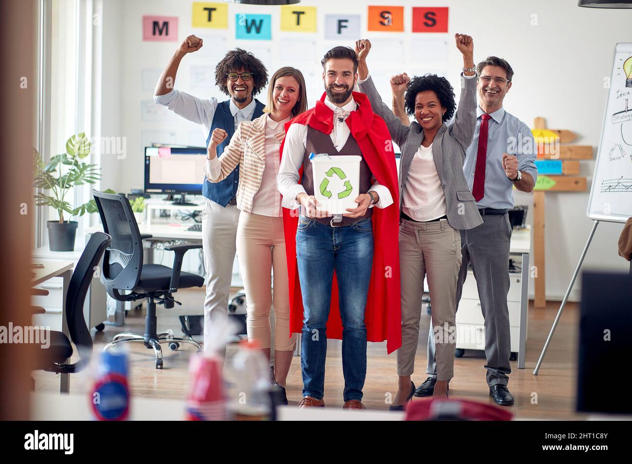 A group of cheerful employees in a pleasant atmosphere in the office ...