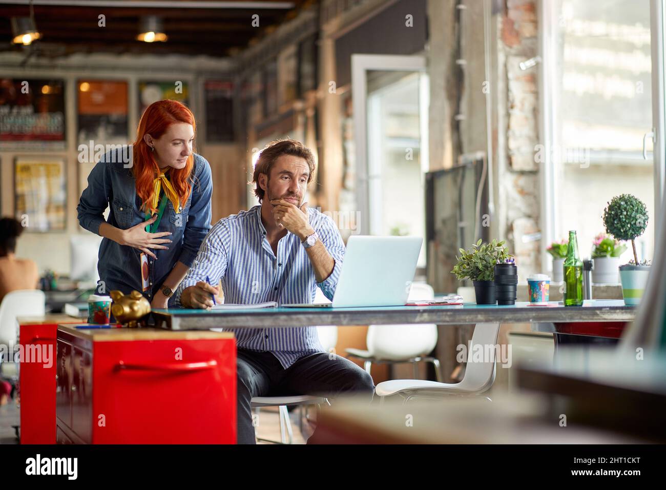 Young employees cooperation together at work in the office Stock Photo ...