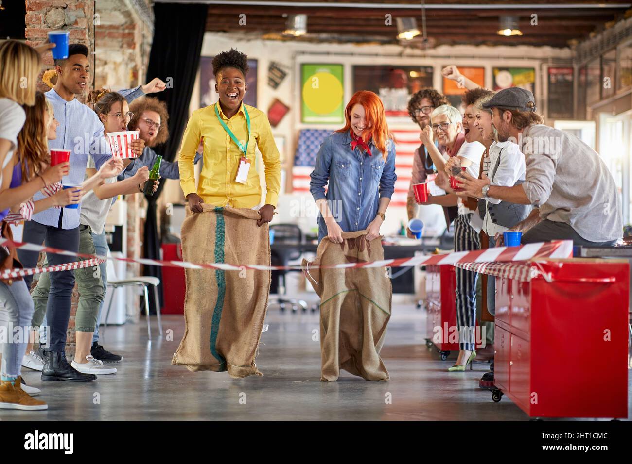 Group of work colleagues having fun together at the office; Casual ...