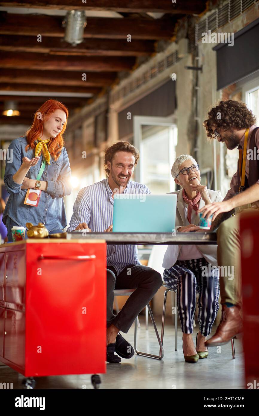 Group of young work colleagues brainstorming with senior colleague ...