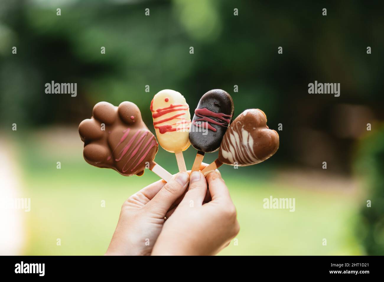 Closeup shot of kids holding different popsicles Stock Photo - Alamy
