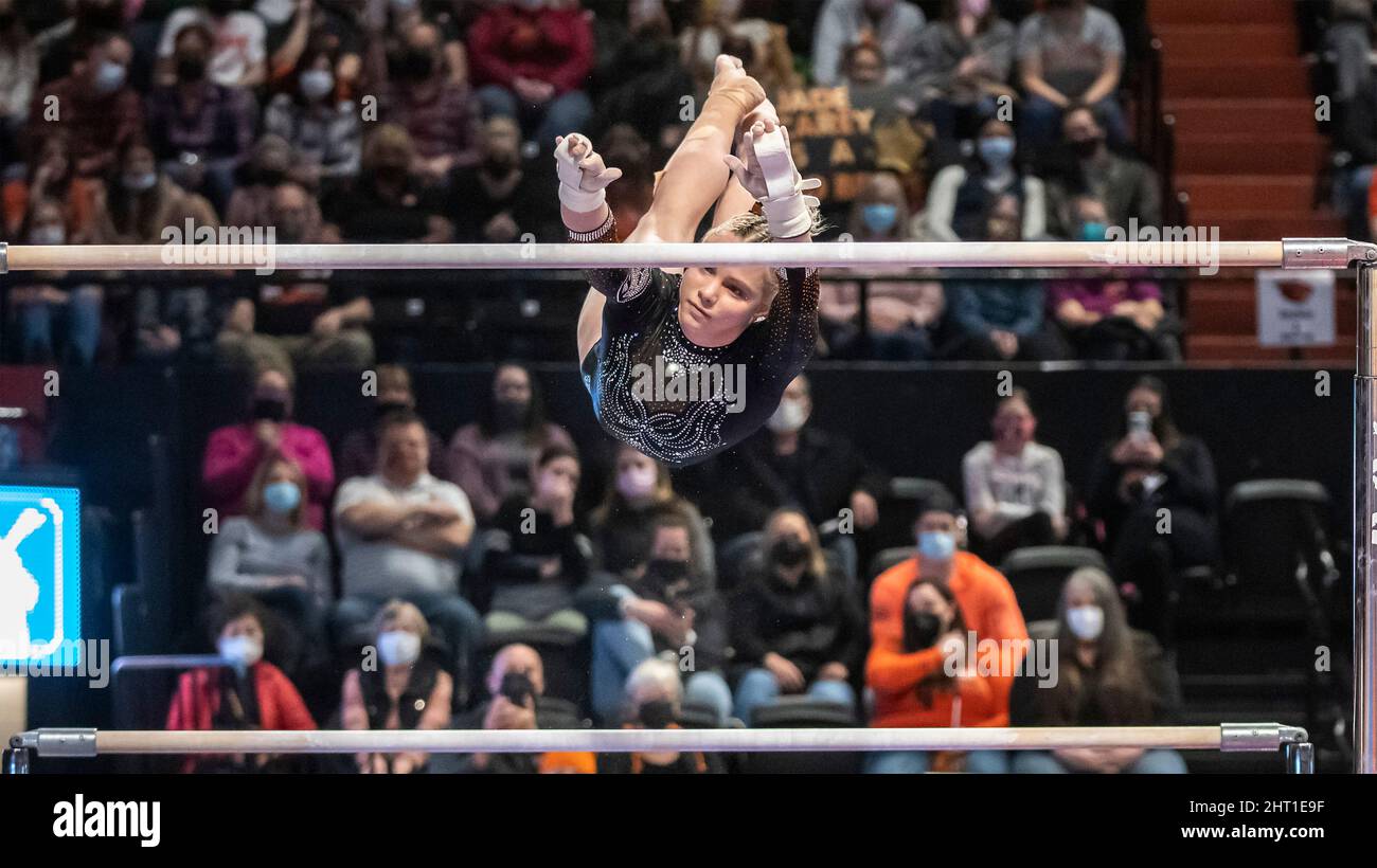 OSU's Jade Carey, the 2020 Olympic gold medalist on floor exercise, swings from the low bar to ...