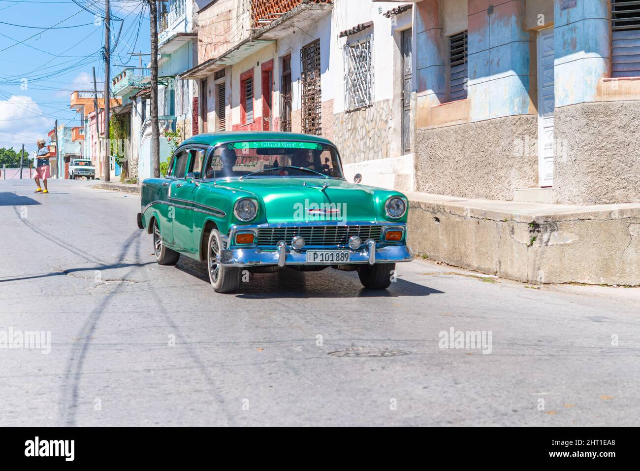 Old classic Chevrolet green car driving in Maceo Street, Santa Clara ...