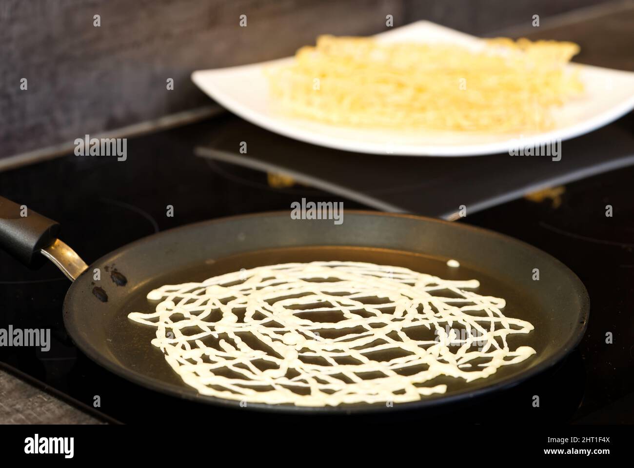 Cooking net pancakes at home. unusual street food. Roti Jala malaysian ...