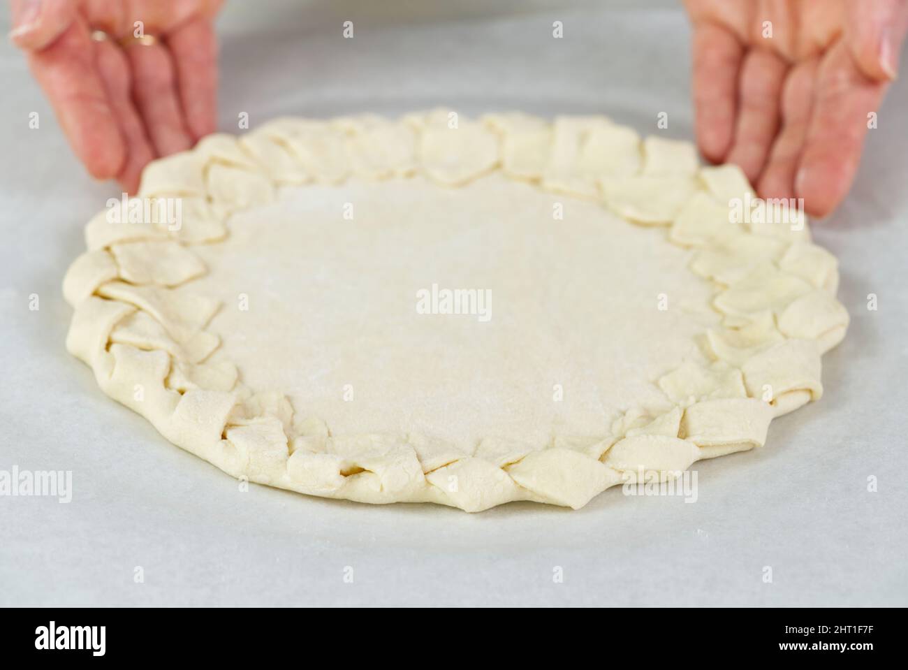 Pizza making process. Top view of pizza dough base. Home-baking pizza ...