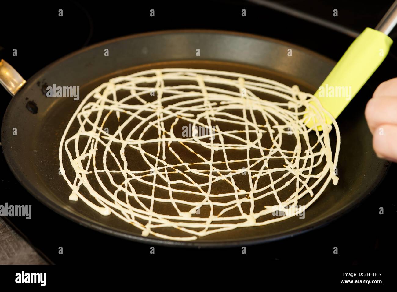 Cooking net pancakes at home. unusual street food. Roti Jala malaysian ...