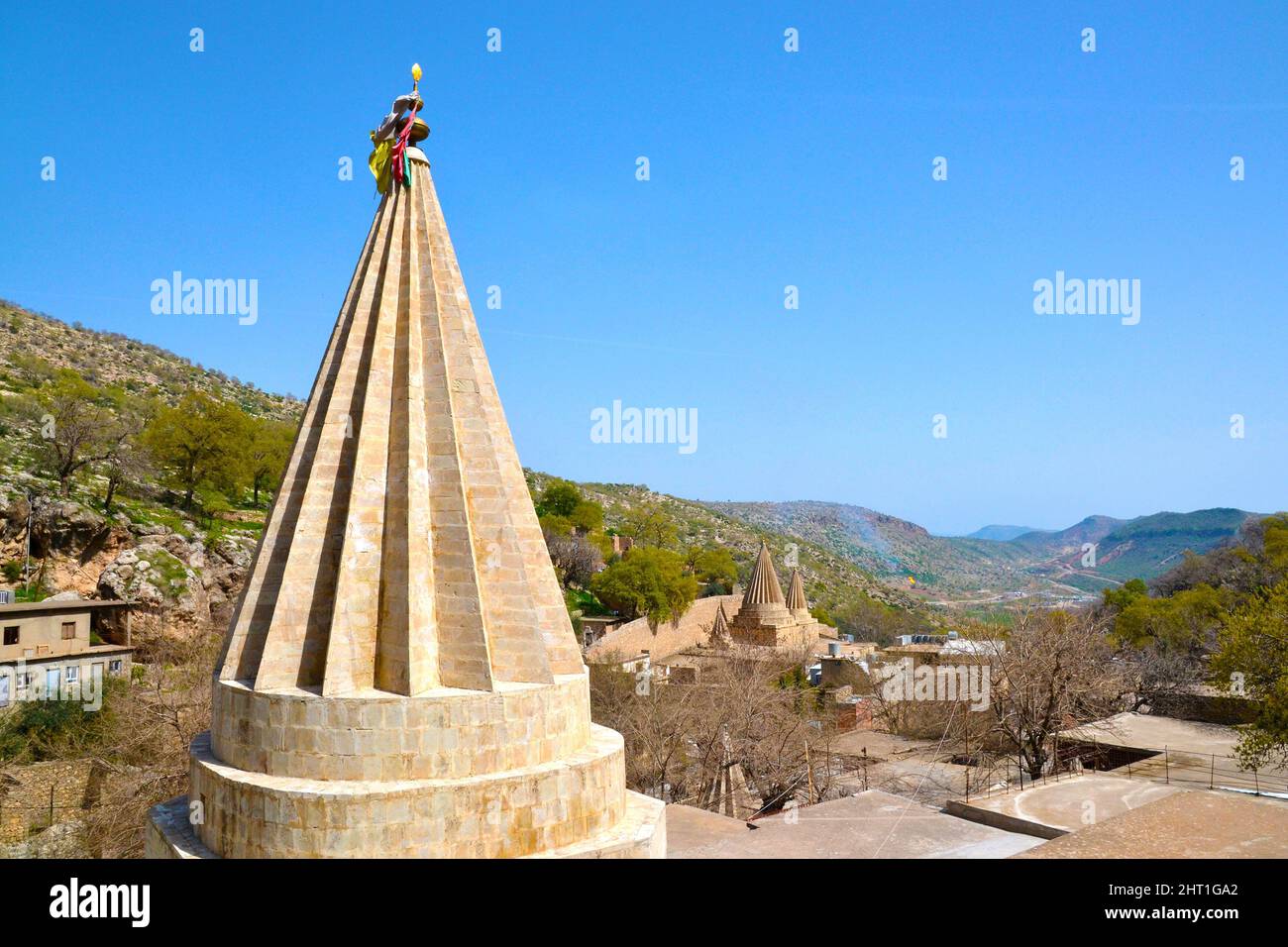 Lalish, Iraq - March 20, 2018: Temple towers, tombs with colored ...