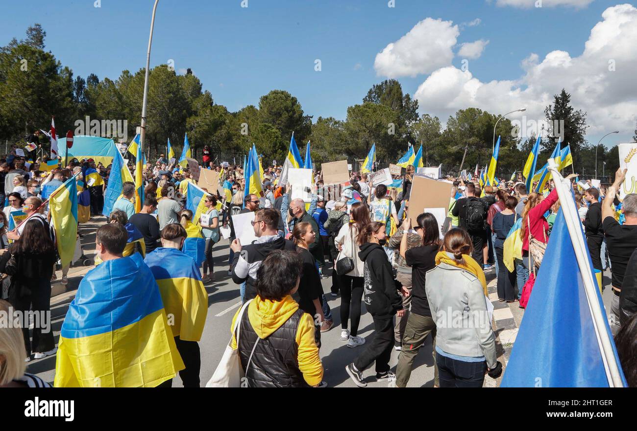 Protesters hold placards and flags during the demonstration. People ...