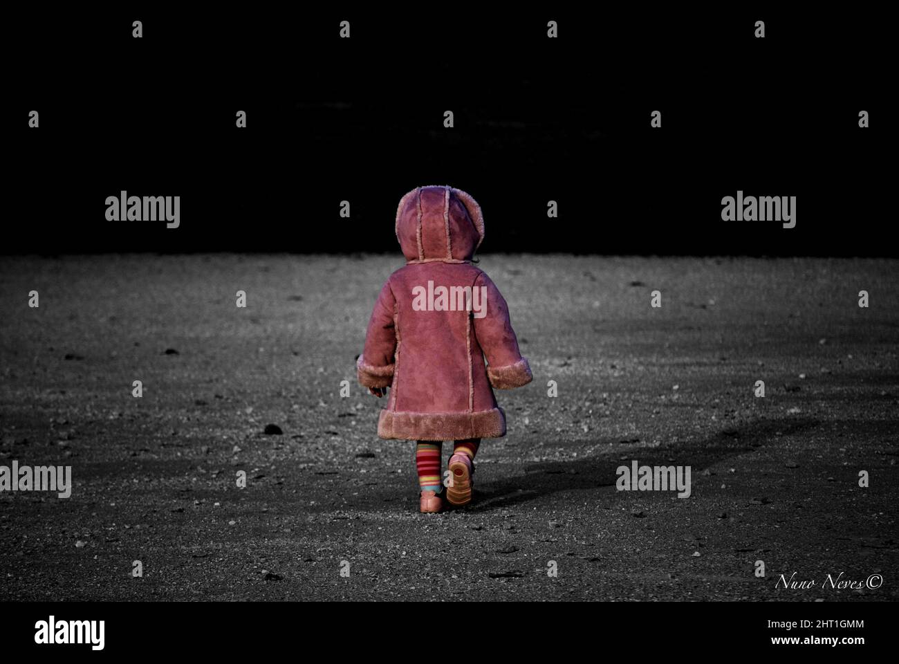 Closeup of a little girl walking alone in empty streets Stock Photo - Alamy