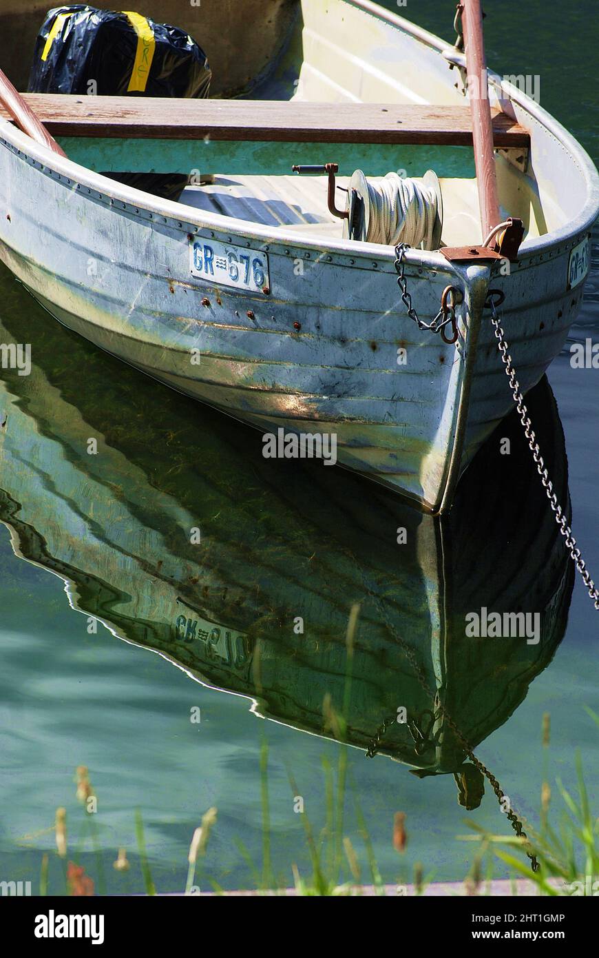 Closeup of a boat with its reflection in the water Stock Photo - Alamy