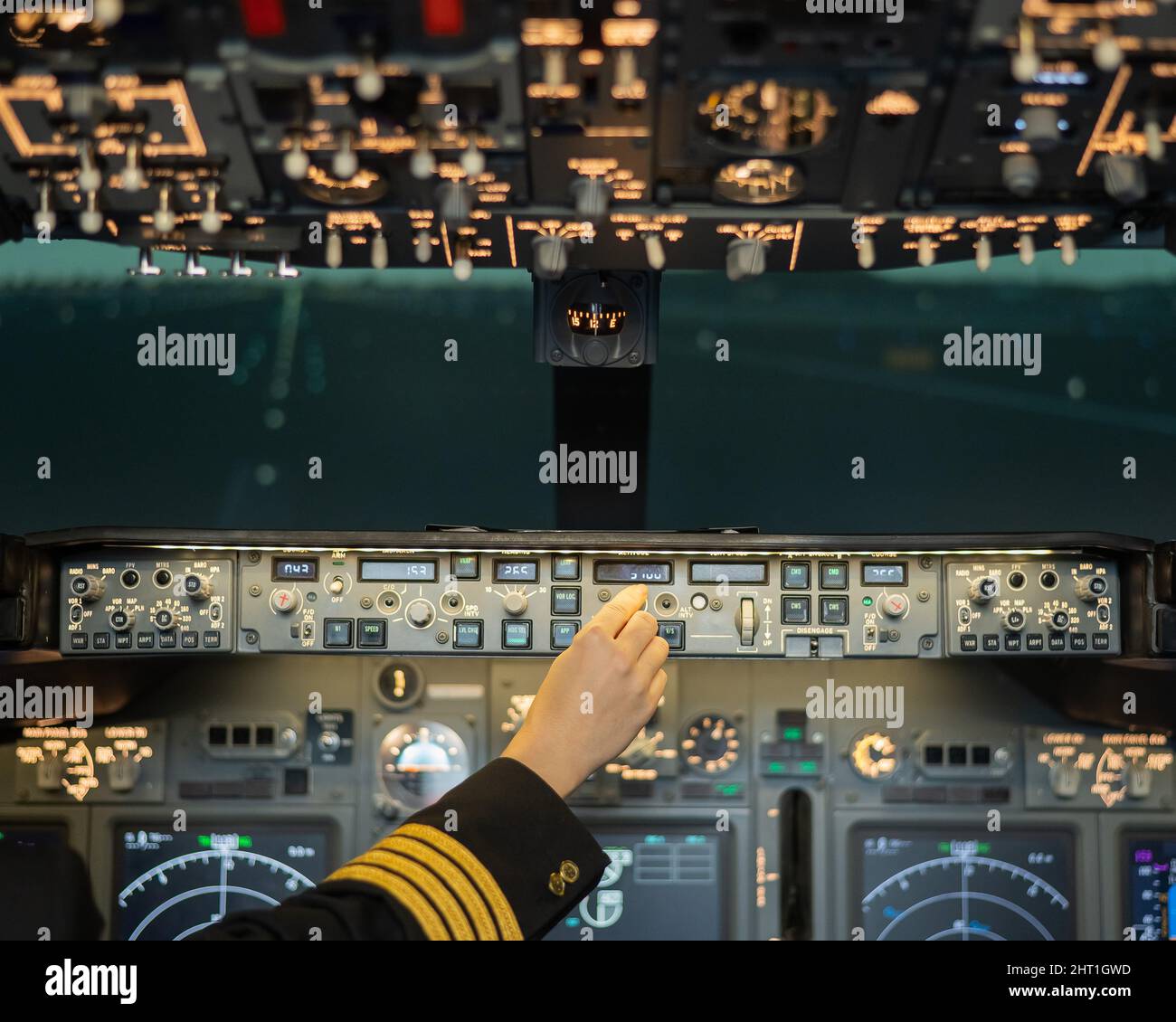 Close-up of a pilot's hand on an airplane control panel Stock Photo - Alamy