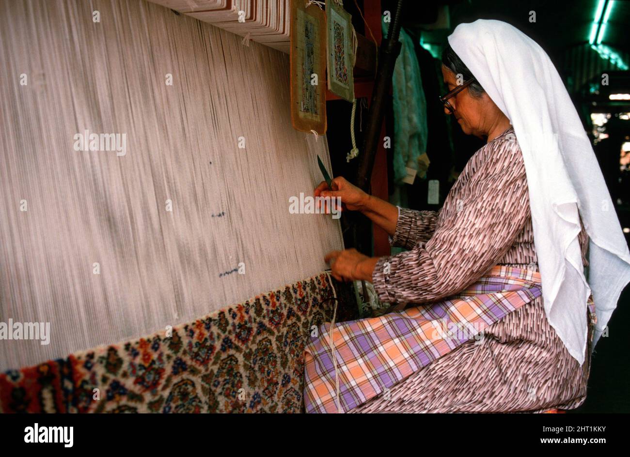 Carpet weaver in Rhodos town, Rhodes Island, Dodecanese, Greece, Europe ...