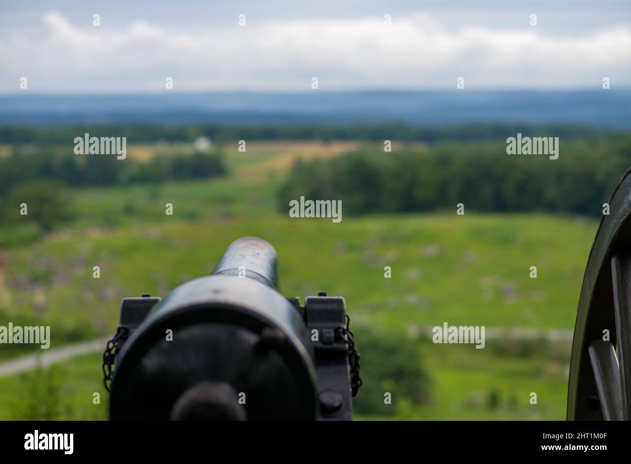 Backshot of an old black metal cannon outdoors in National Historical ...