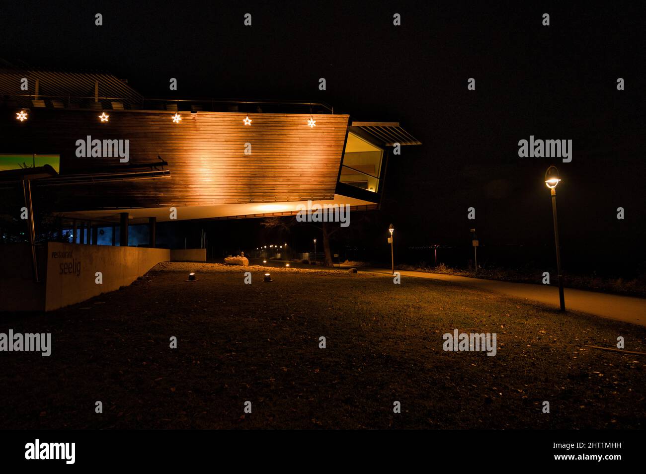 Night view of modern architecture near Lake Constance with lights in ...
