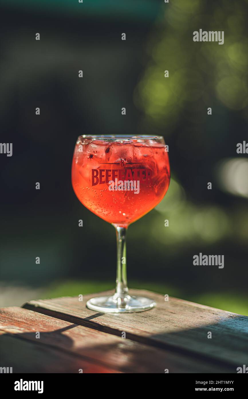 Vertical closeup of a glass of Beefeater gin Stock Photo - Alamy