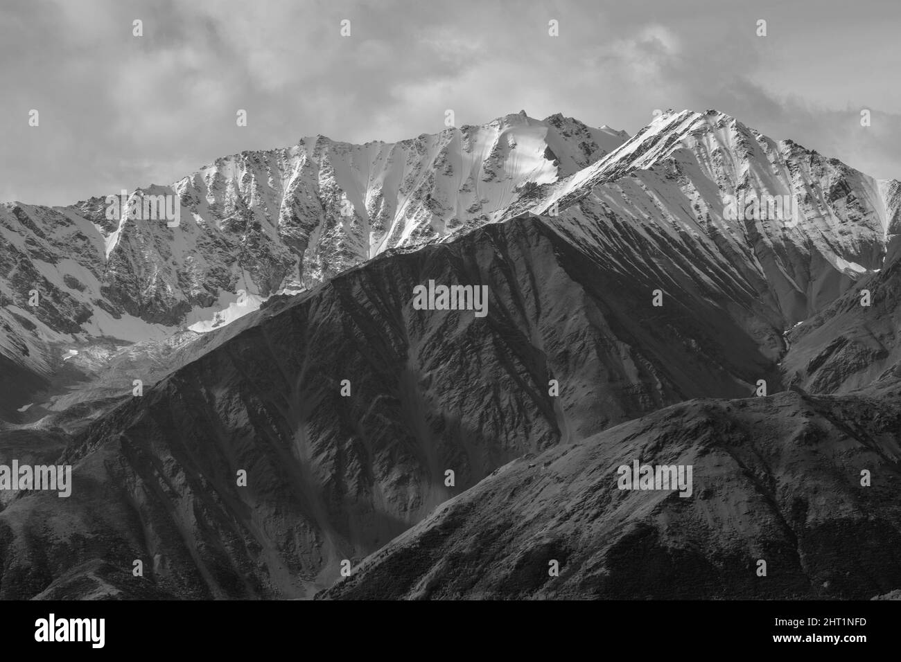 Grayscale of snowy mountains Stock Photo - Alamy