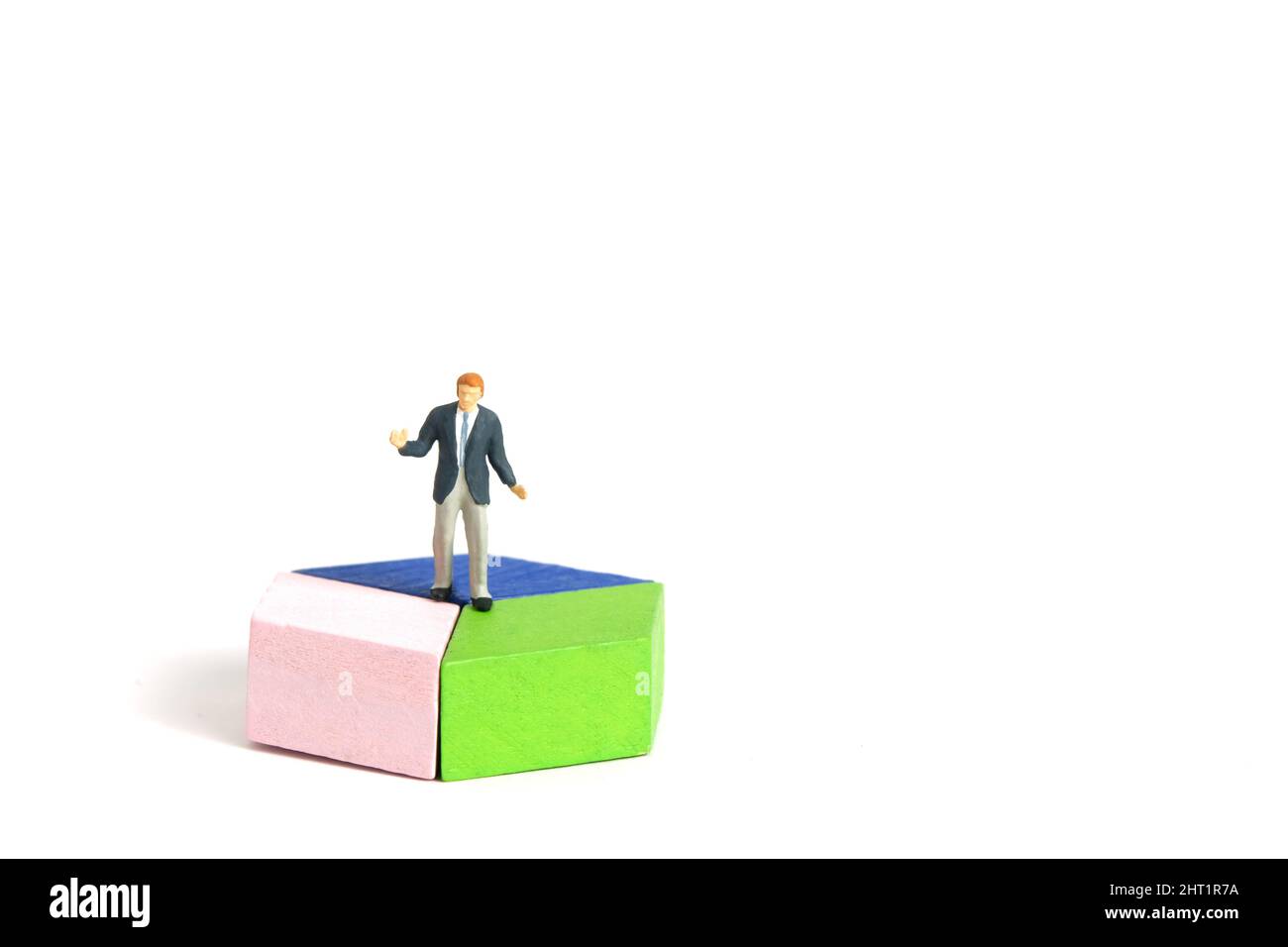 Miniature people toy figure photography. A shrugging businessman doing ...