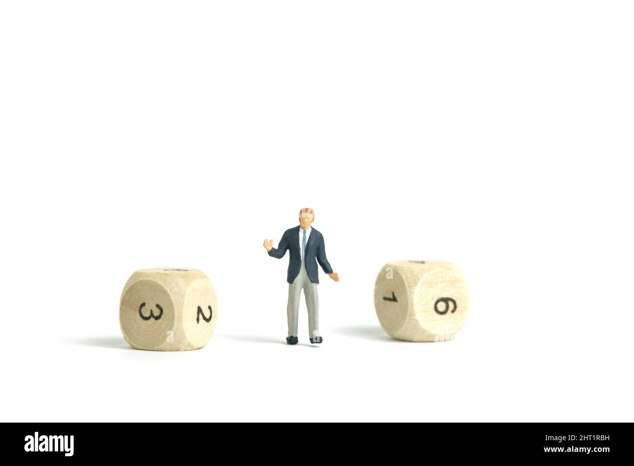 Miniature people toy figure photography. A shrugging businessman ...