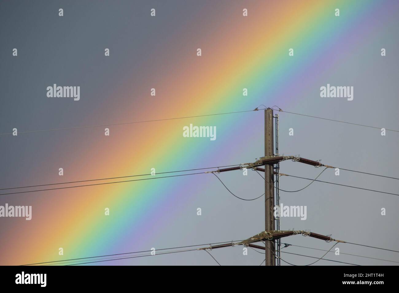 Colorful rainbow in the sky with electrical cables foreground Stock ...