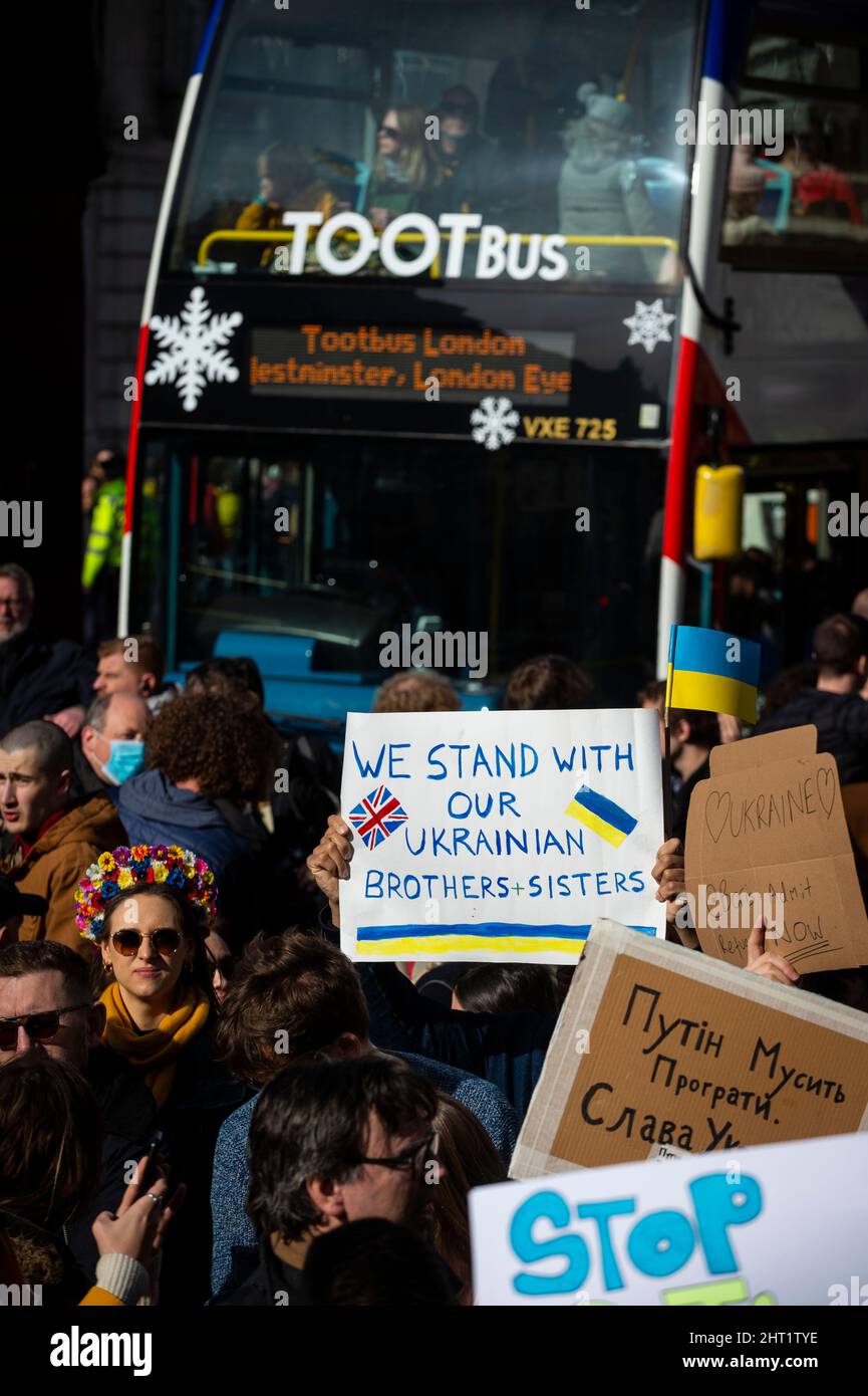 London, UK. 26 February 2022. A tour bus passes Ukrainians in the UK at ...