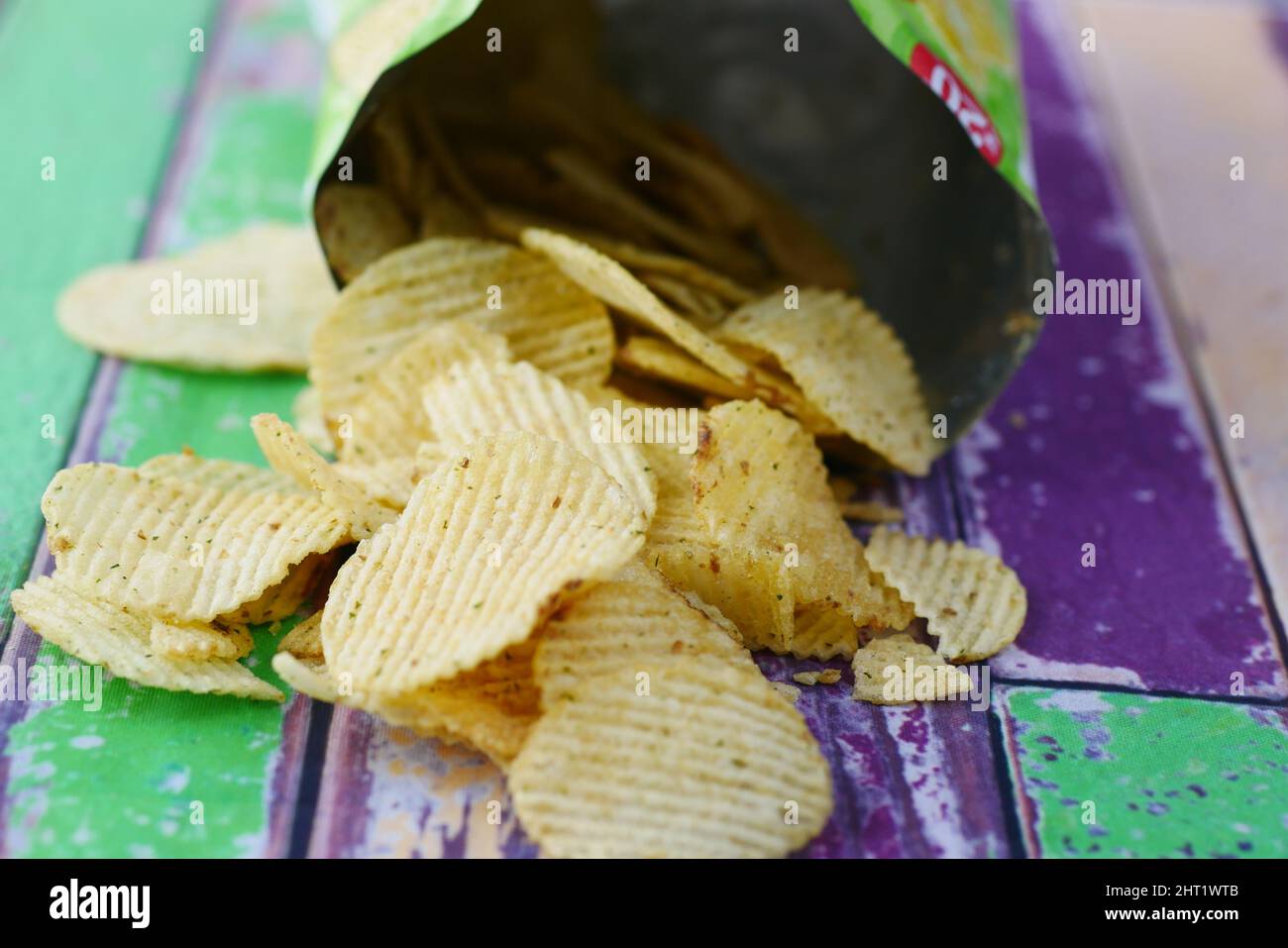 a open potato chips packet on table Stock Photo - Alamy